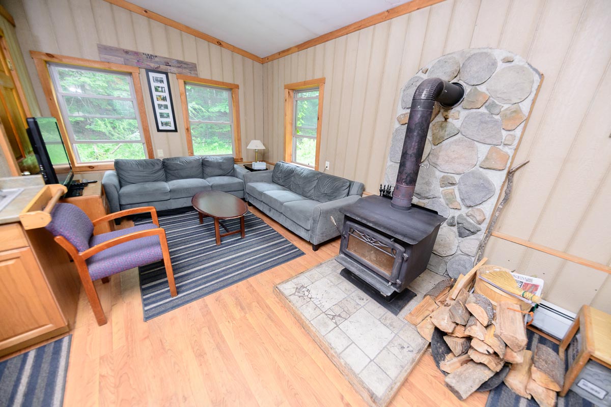 Cabin interior with a wood burning stove - Pyramid Life Center